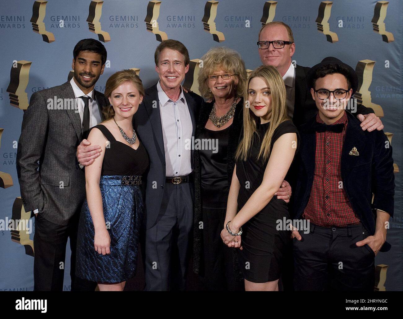 The cast and producers of Degrassi pose for a photo after being voted ...