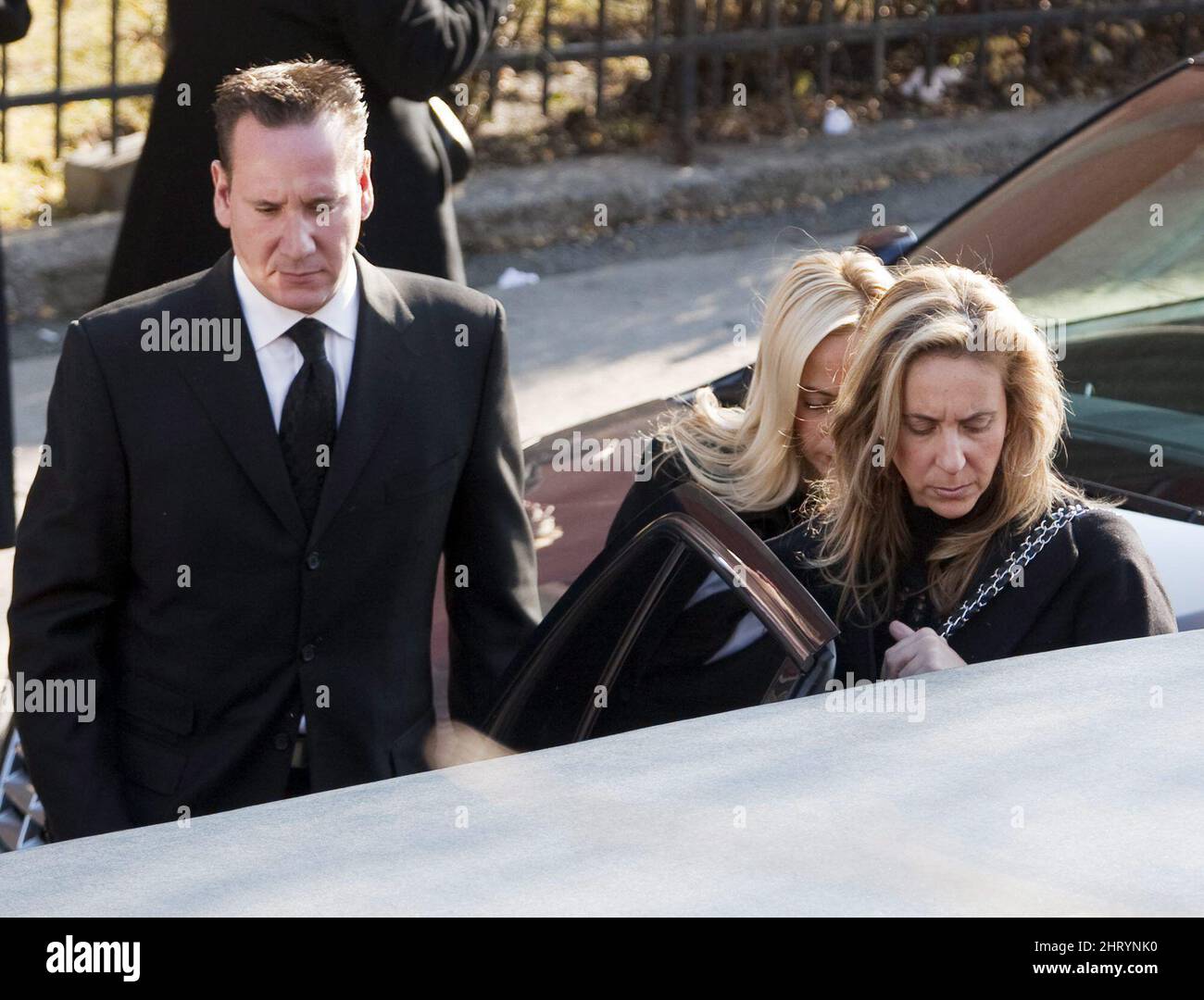 Leonardo Rizzuto, left, and his sister Bettina Rizzuto, right, leave ...