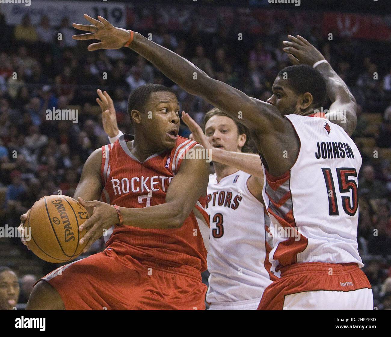 Houston Rockets guard Kyle Lowry, left, drives past Toronto Raptors ...