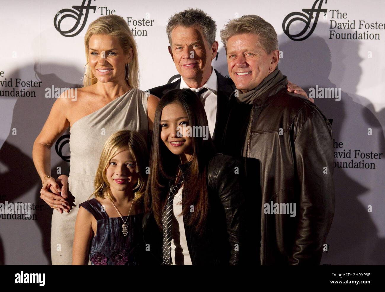 David Foster (centre rear) poses for photographers with (clockwise from ...