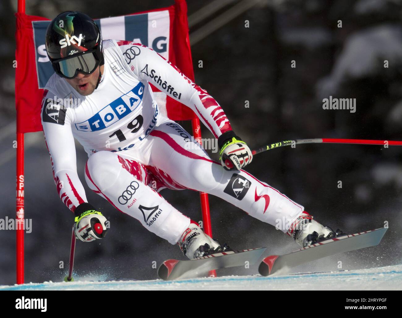 Mario Scheiber of Austria blasts down the course on his way to third ...