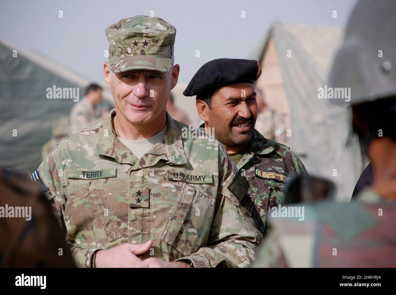 U.S. Maj.-Gen. James Terry listens to Afghan troops try to recite the ...