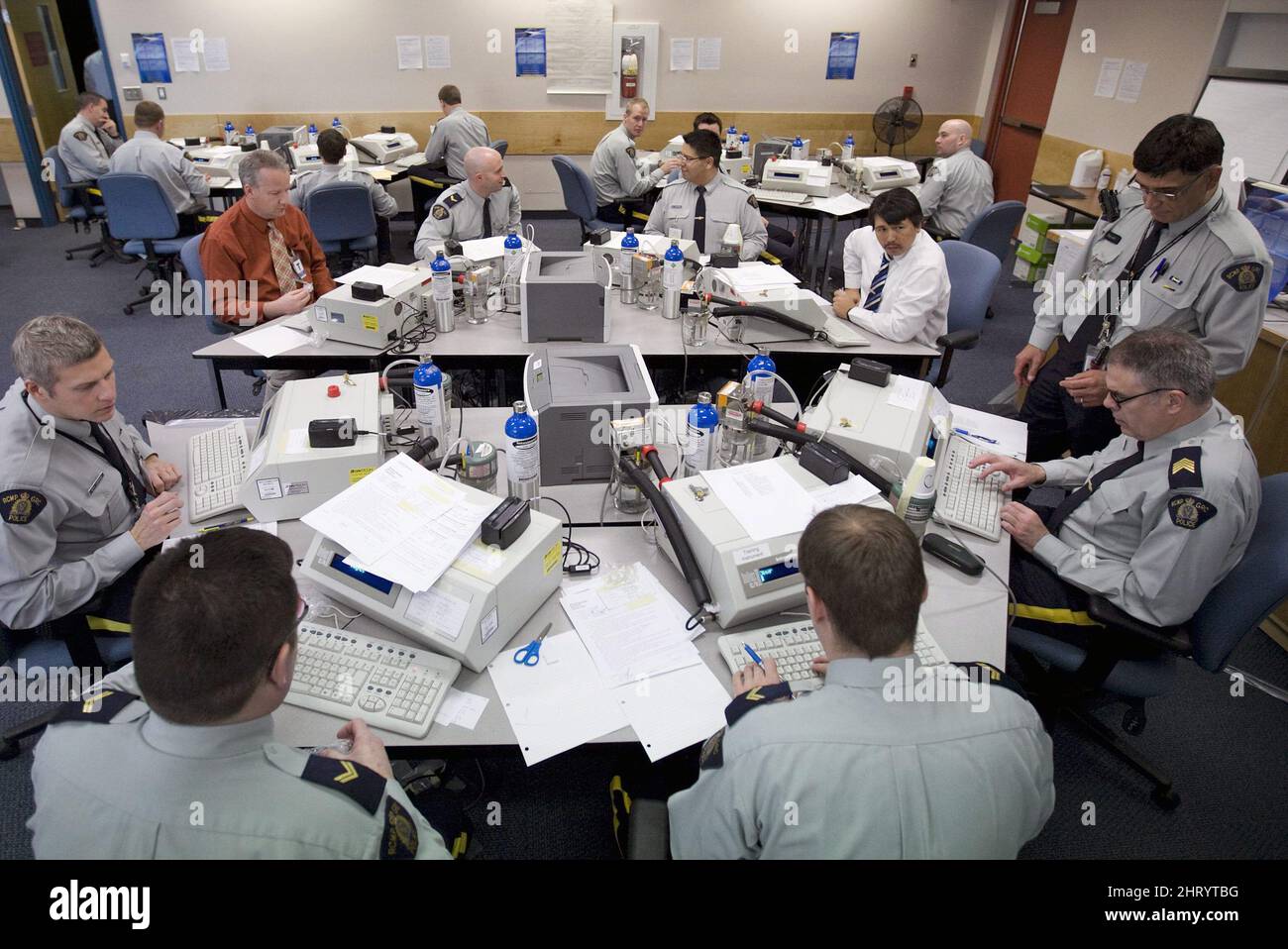 RCMP Const. Pete Broccolo, senior field facilitator, right, works with ...