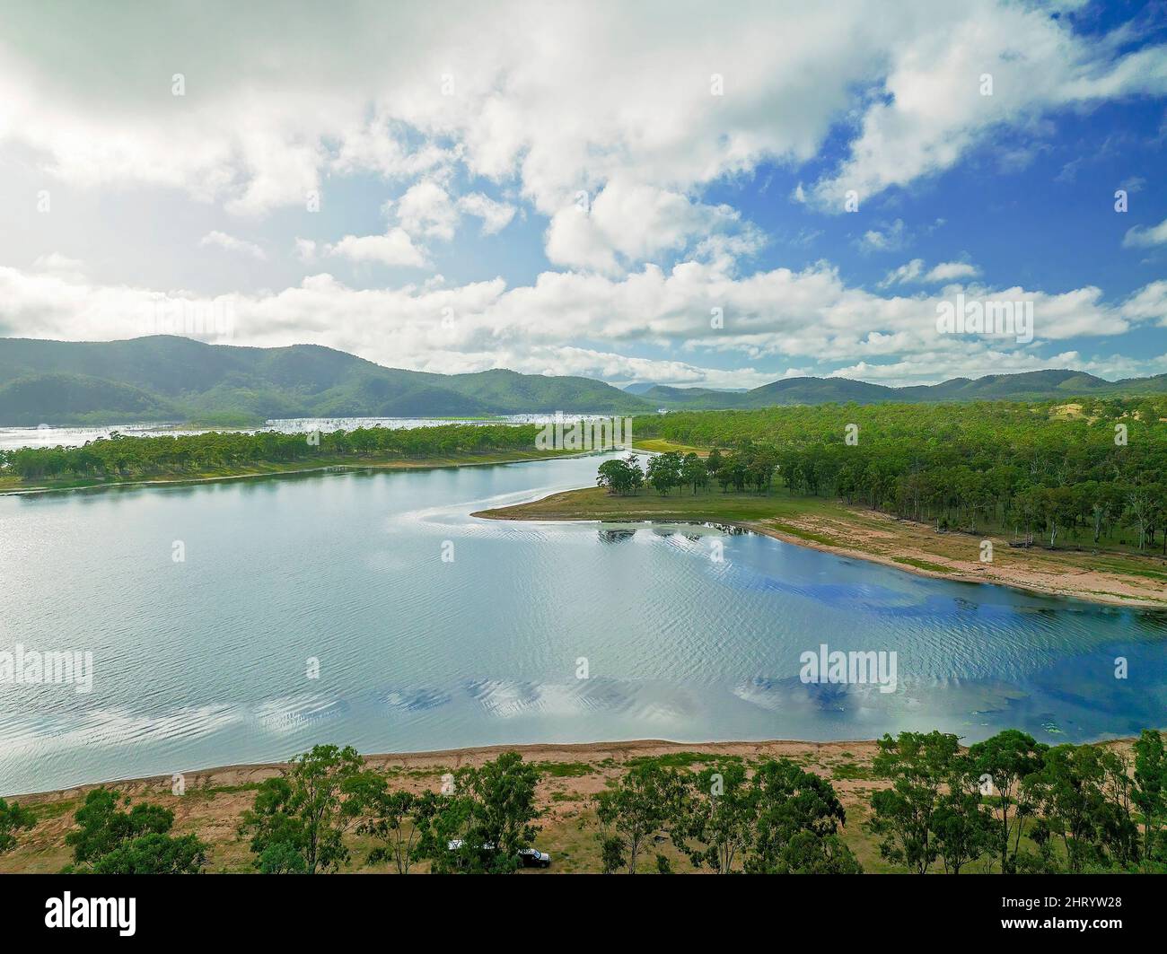 Drone aerial landscape of Eungella Dam with free campers on the waters ...