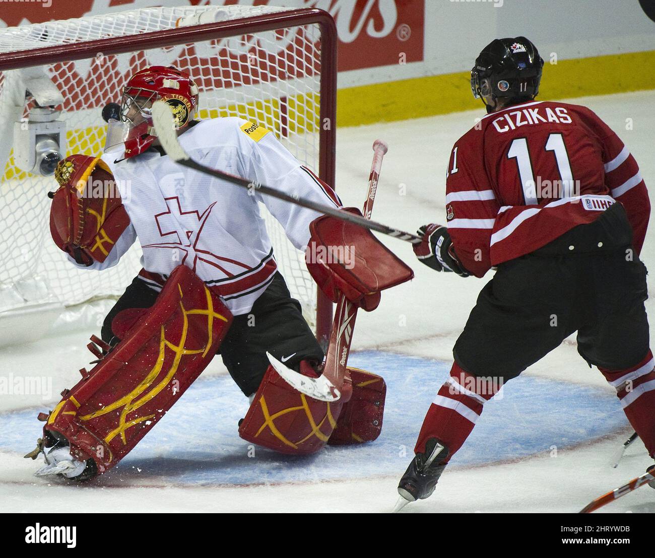 Team Canada forward Casey Cizikas (11) scores past Team Switzerland ...