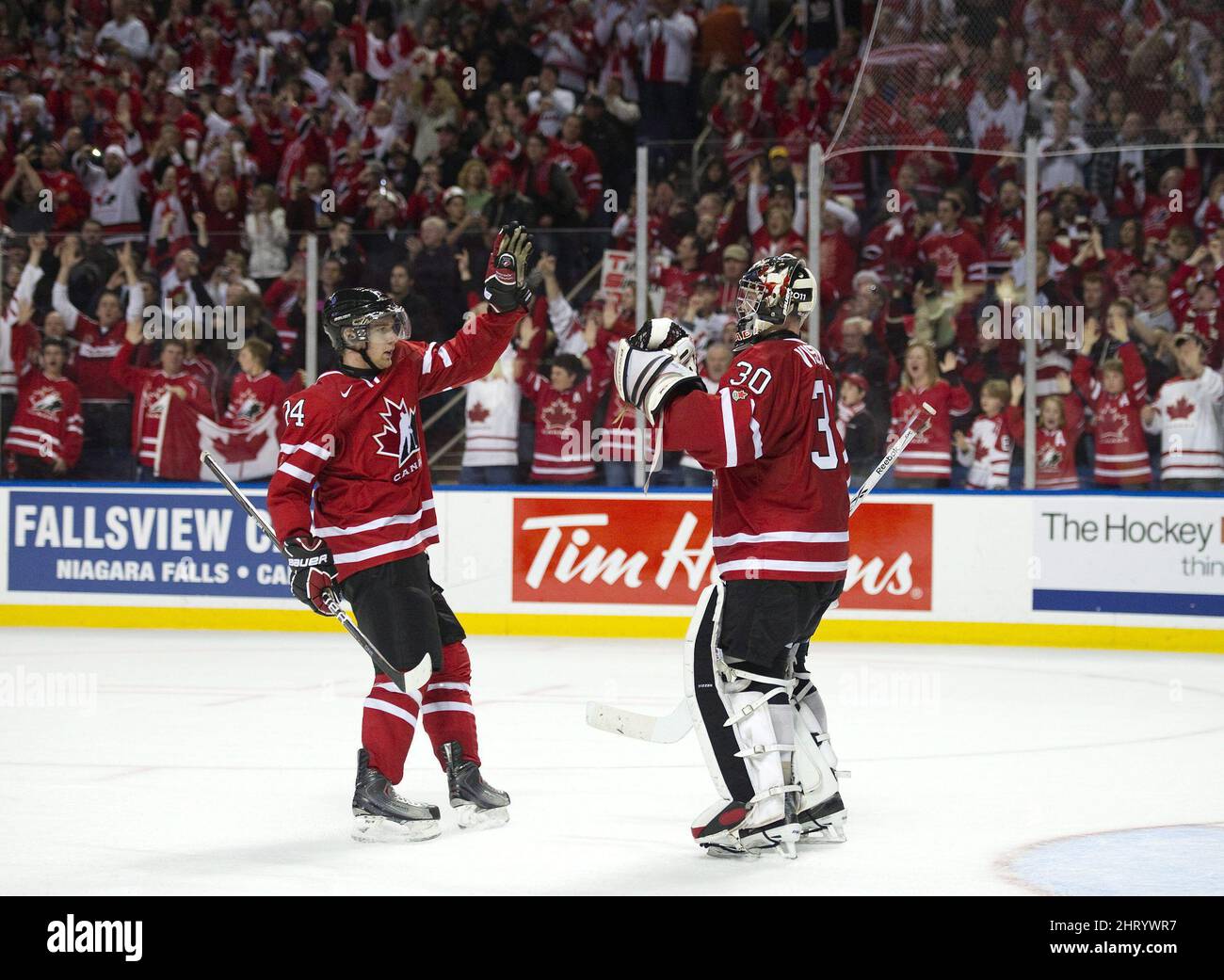 Team Canada teammates Calvin de Haan, left, celebrates with goalie Mark ...