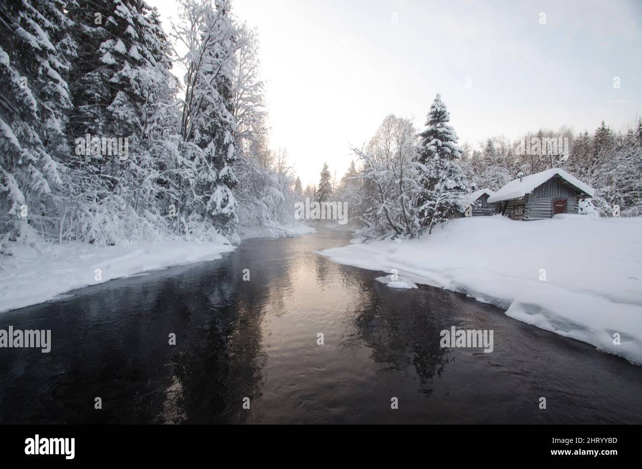 Wooden bathhouse on the bank of a forest river. Rest in the countryside ...