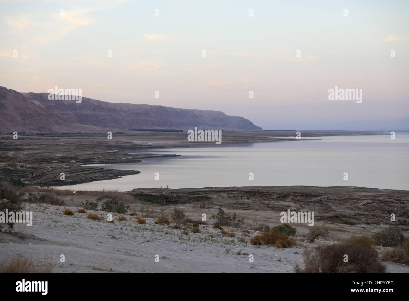 View of the vibrant sunset looking towards the horizon at the Dead Sea ...
