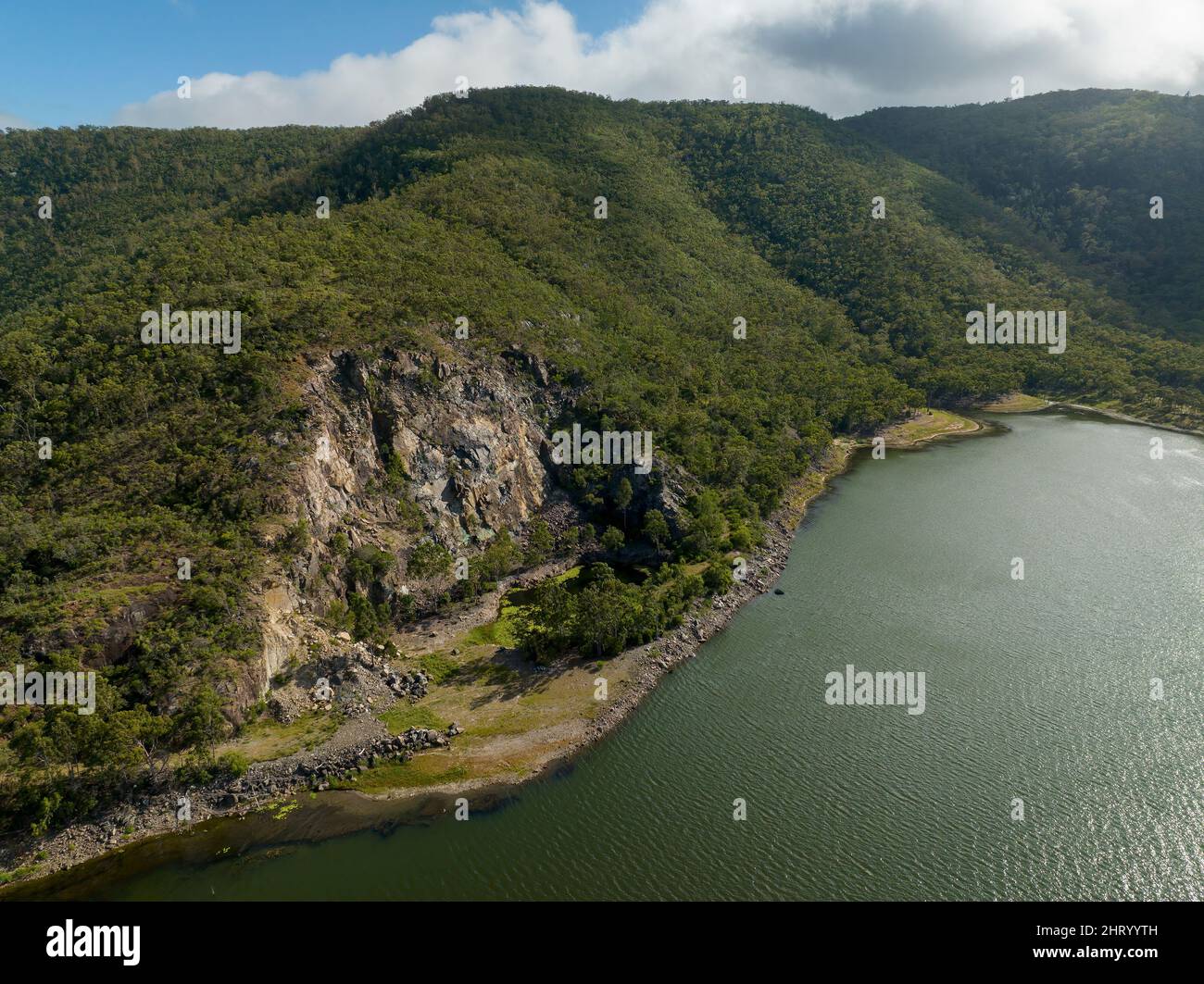 Rock wall quarry on a mountain range on the banks of Eungella Dam ...