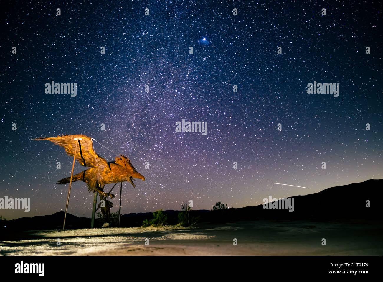 Statue of a mythical bird on a starry night sky Stock Photo - Alamy