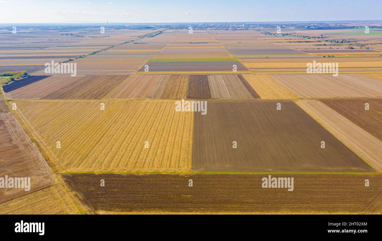 Above view on agricultural fields, after harvest, empty cultivated ...