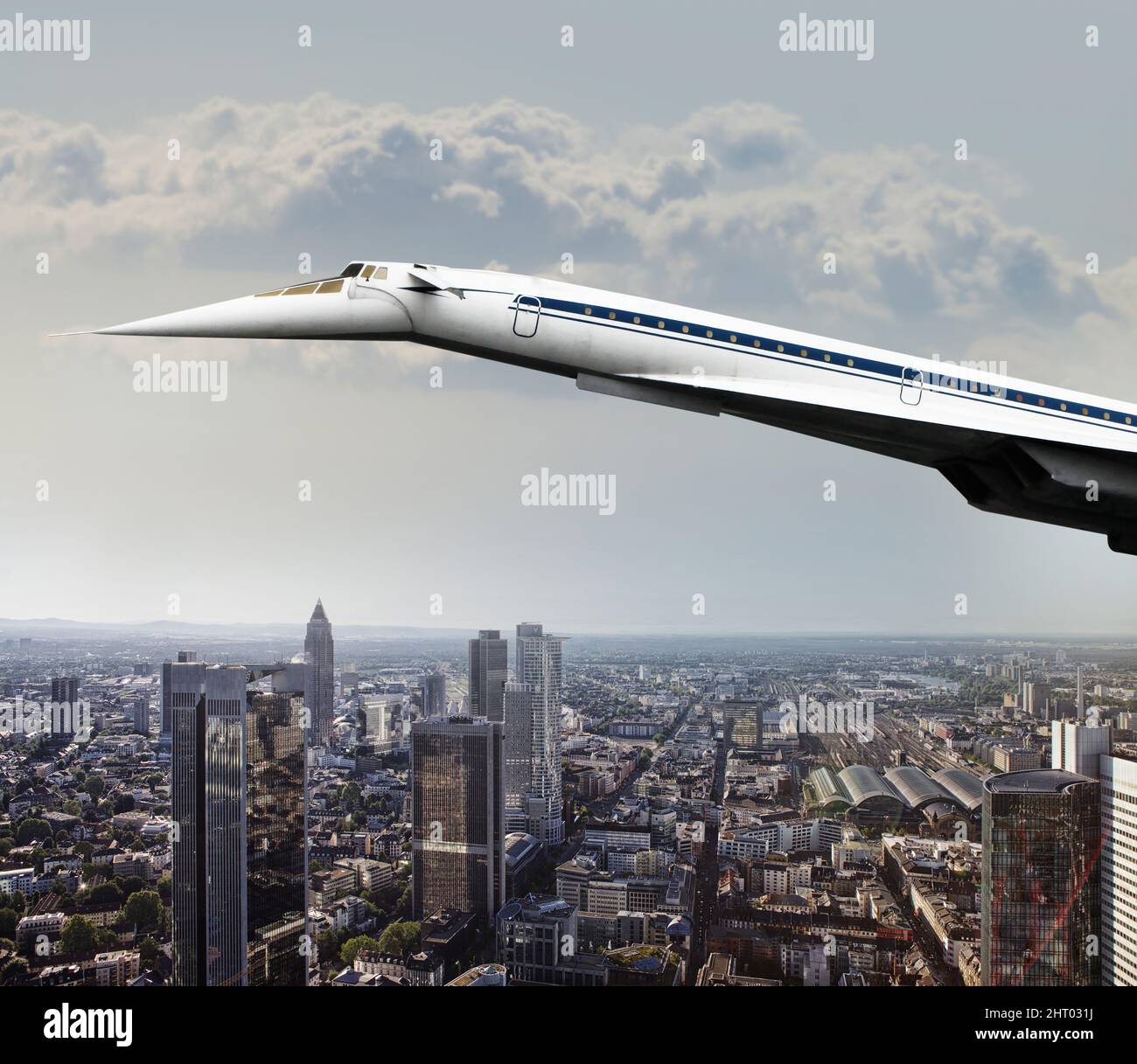 Aerial view of a plane flying over a modern city Stock Photo - Alamy