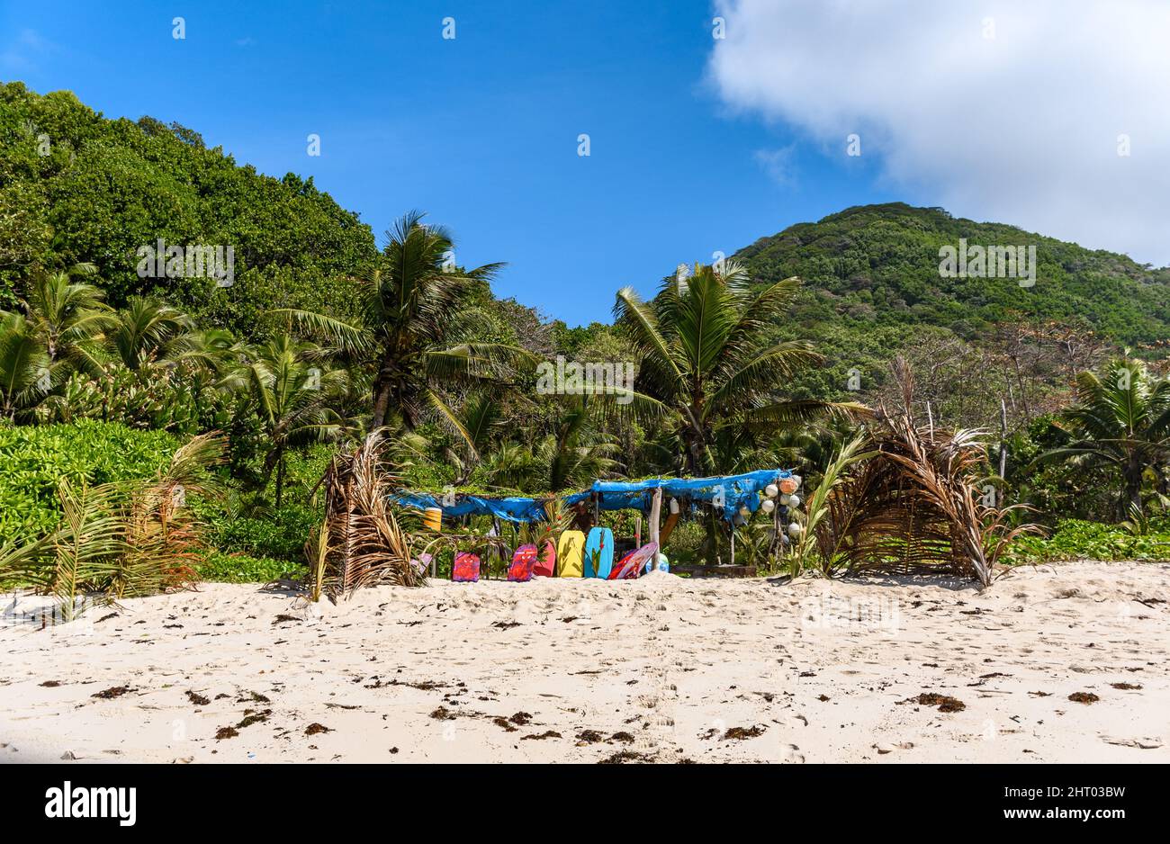 Beach bar under palm trees on sandy beach on tropical island of La ...