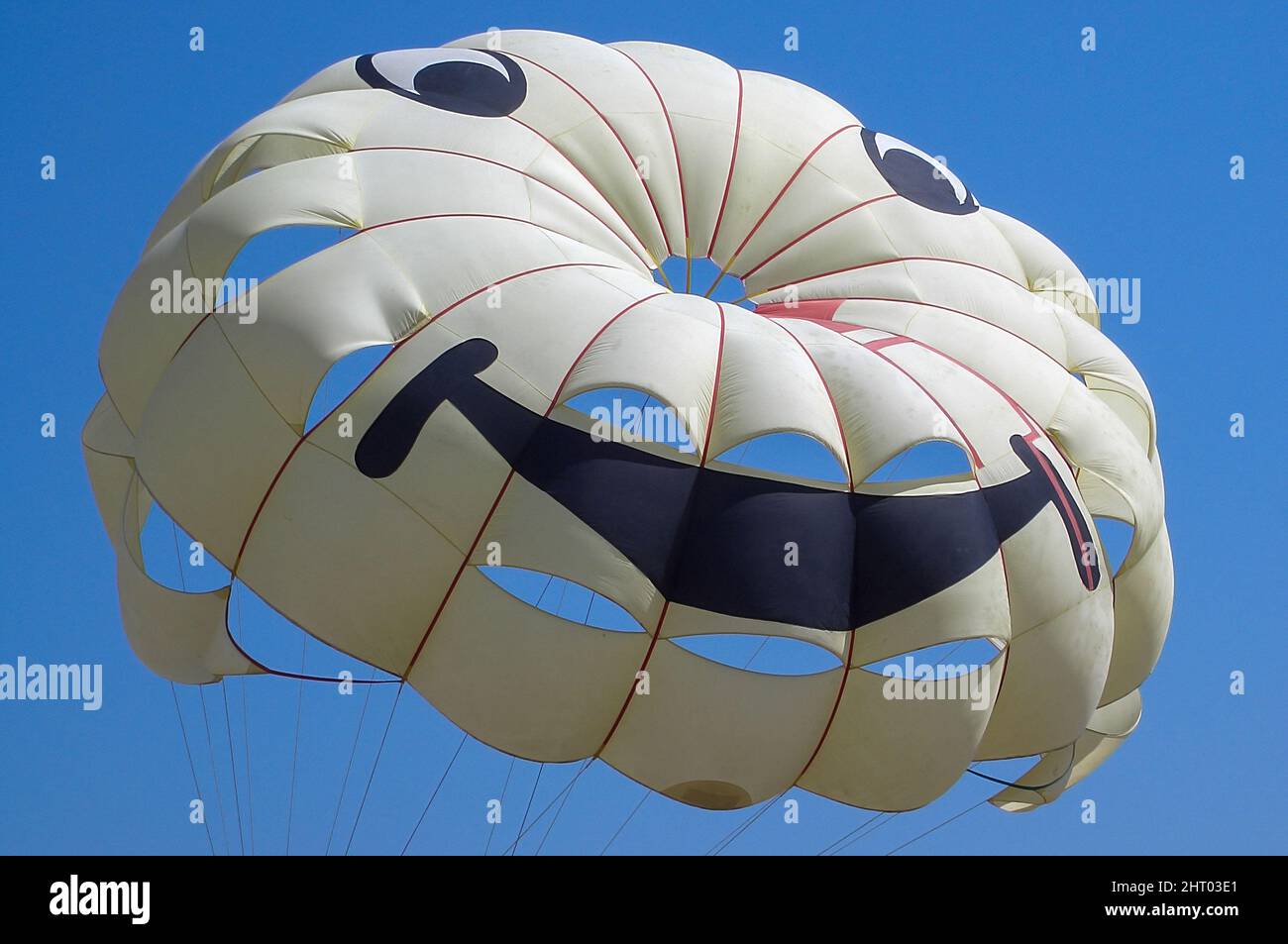 Funny parachute with the blue sky in the background Stock Photo - Alamy
