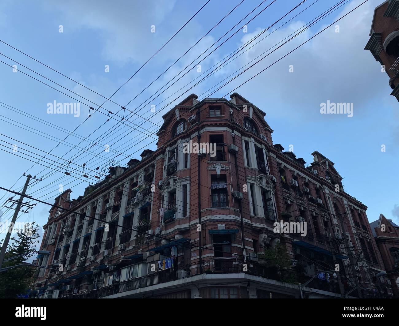 Exterior view of an architectural building on cloudy sky background ...