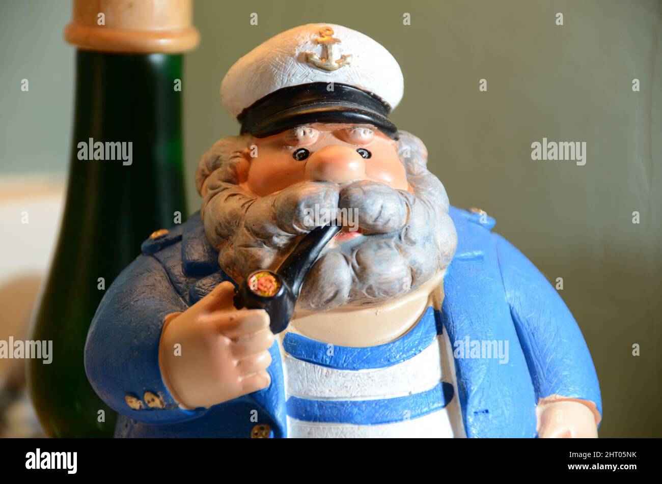 Closeup shot of the old captain figurine with a pipe Stock Photo - Alamy
