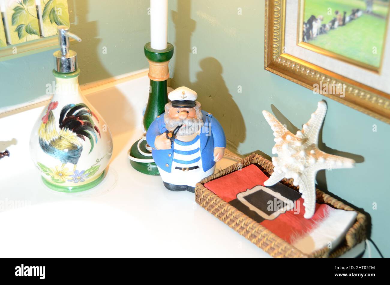 Closeup shot of the old captain figurine with a pipe and other objects ...