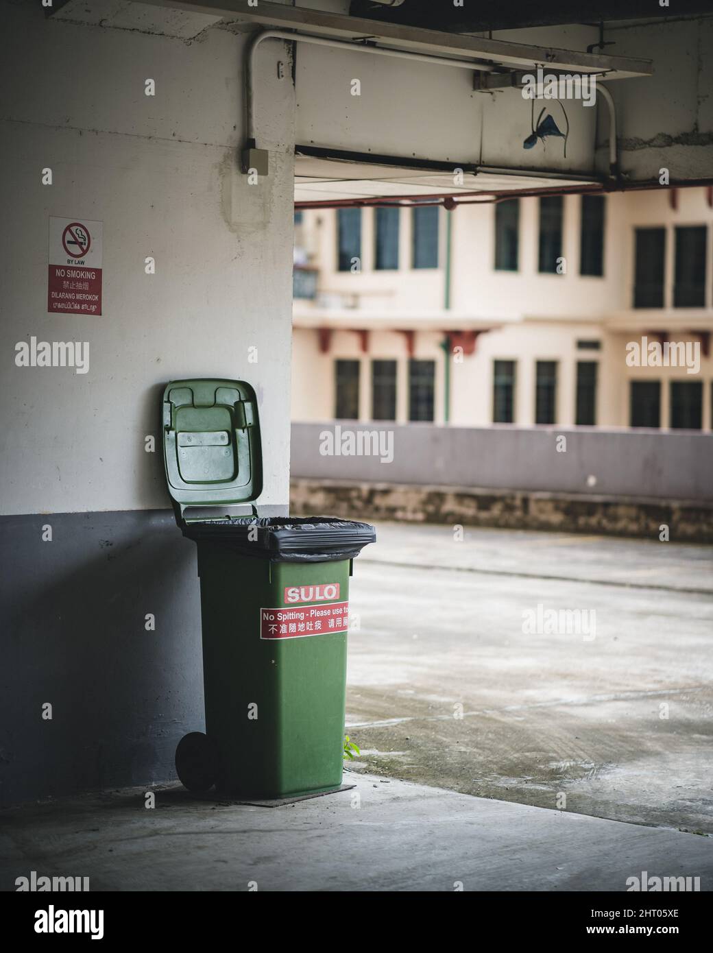 Rubbish bin at the corner of a building Stock Photo - Alamy