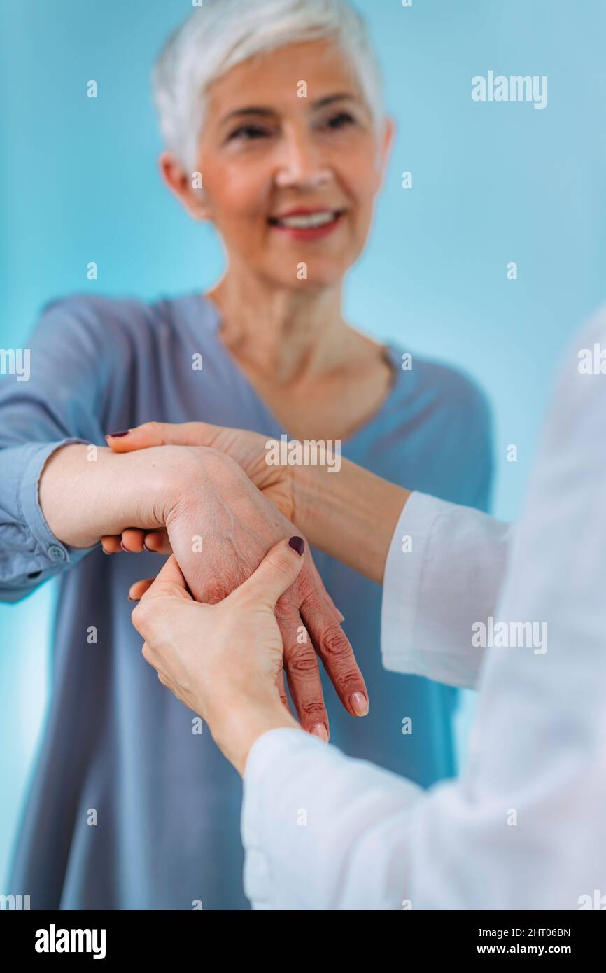 Senior patient having a carpal tunnel syndrome test Stock Photo - Alamy