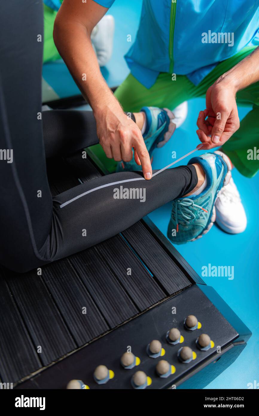 Placing markers for 3D gait analysis in a sports laboratory Stock Photo ...