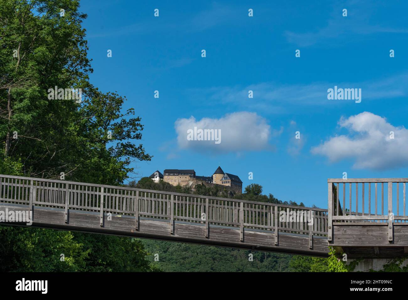Waldeck Castle, a medieval castle complex with a wooden bridge in the ...