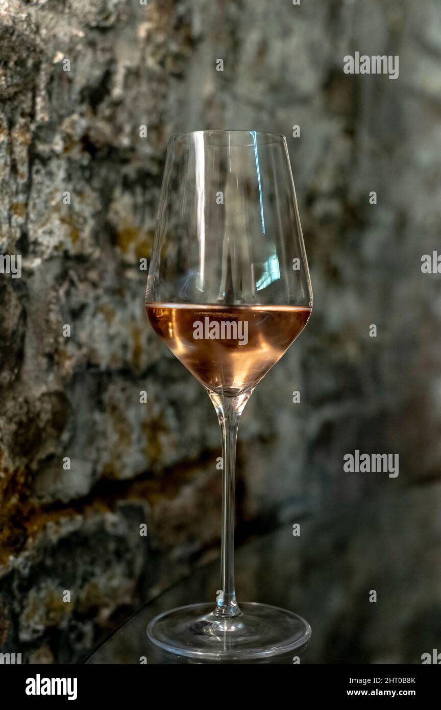 Tasting of brut champagne sparkling wine produced by traditional method in underground caves ...