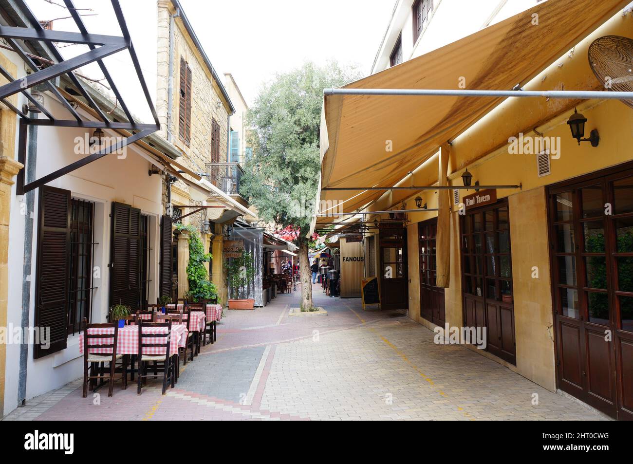 Restaurants with empty seats along the narrow street in the city Stock ...