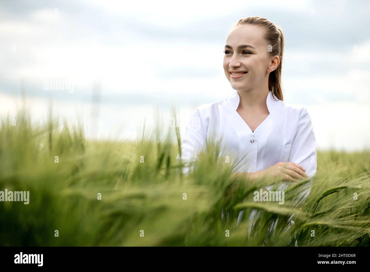 Portrait of Ecologist or biologist in a white coat and glasses ...