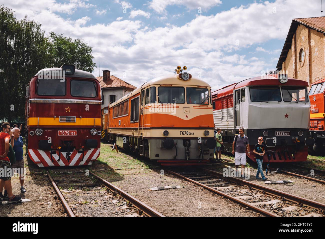 Vertical shot of three diesel locomotives engines resting at a freight ...