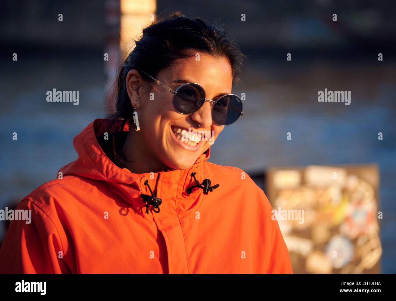Spanish girl in sunglasses smiling and posing for a photo Stock Photo ...