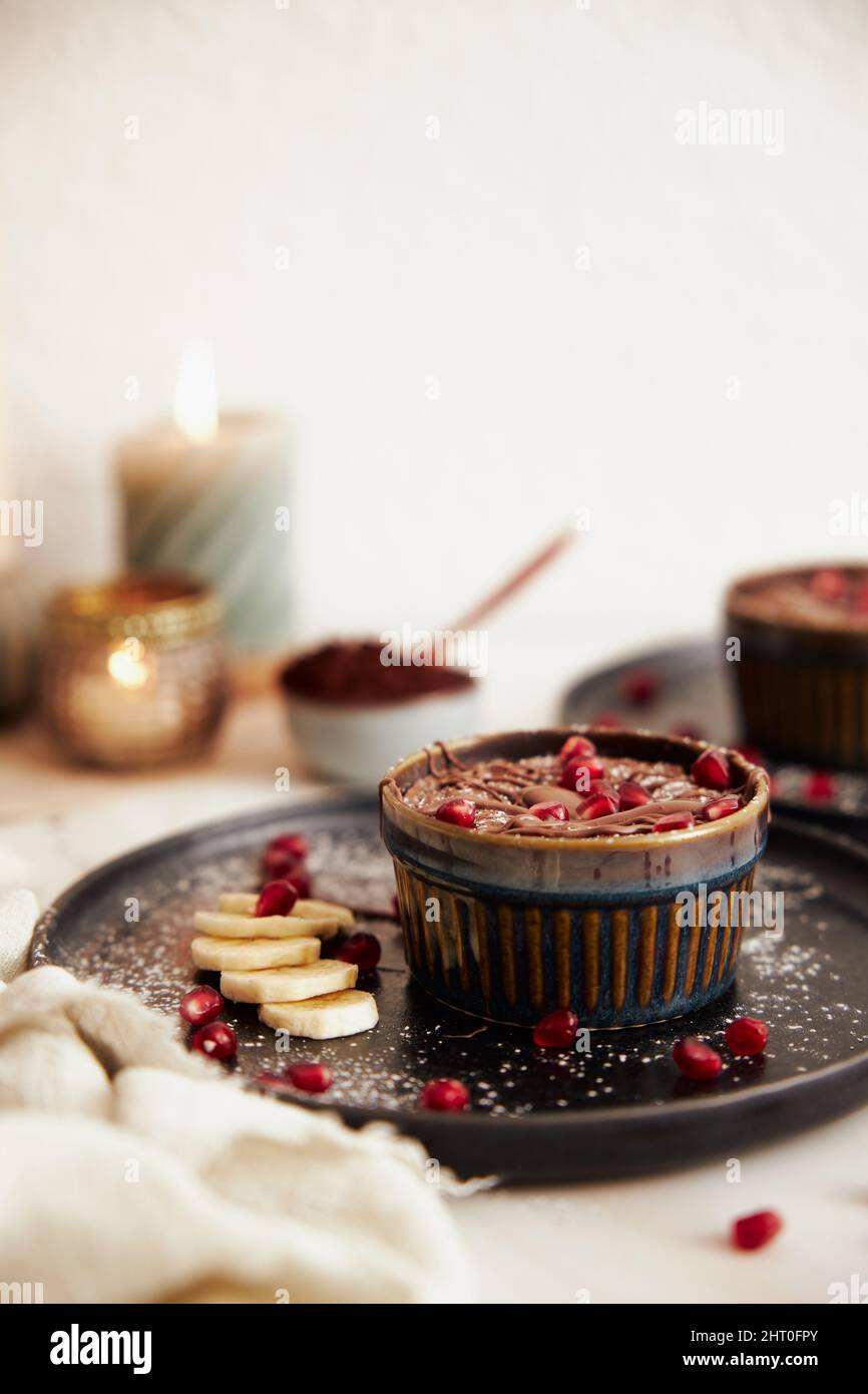 Closeup shot of a delicious hot lava cake with banana and fruits Stock ...