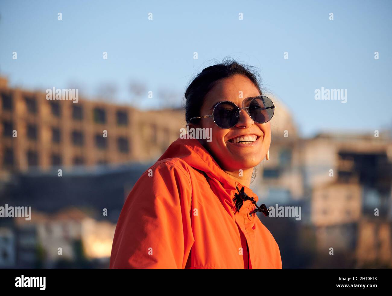 Spanish girl in sunglasses smiling and posing for a photo Stock Photo ...
