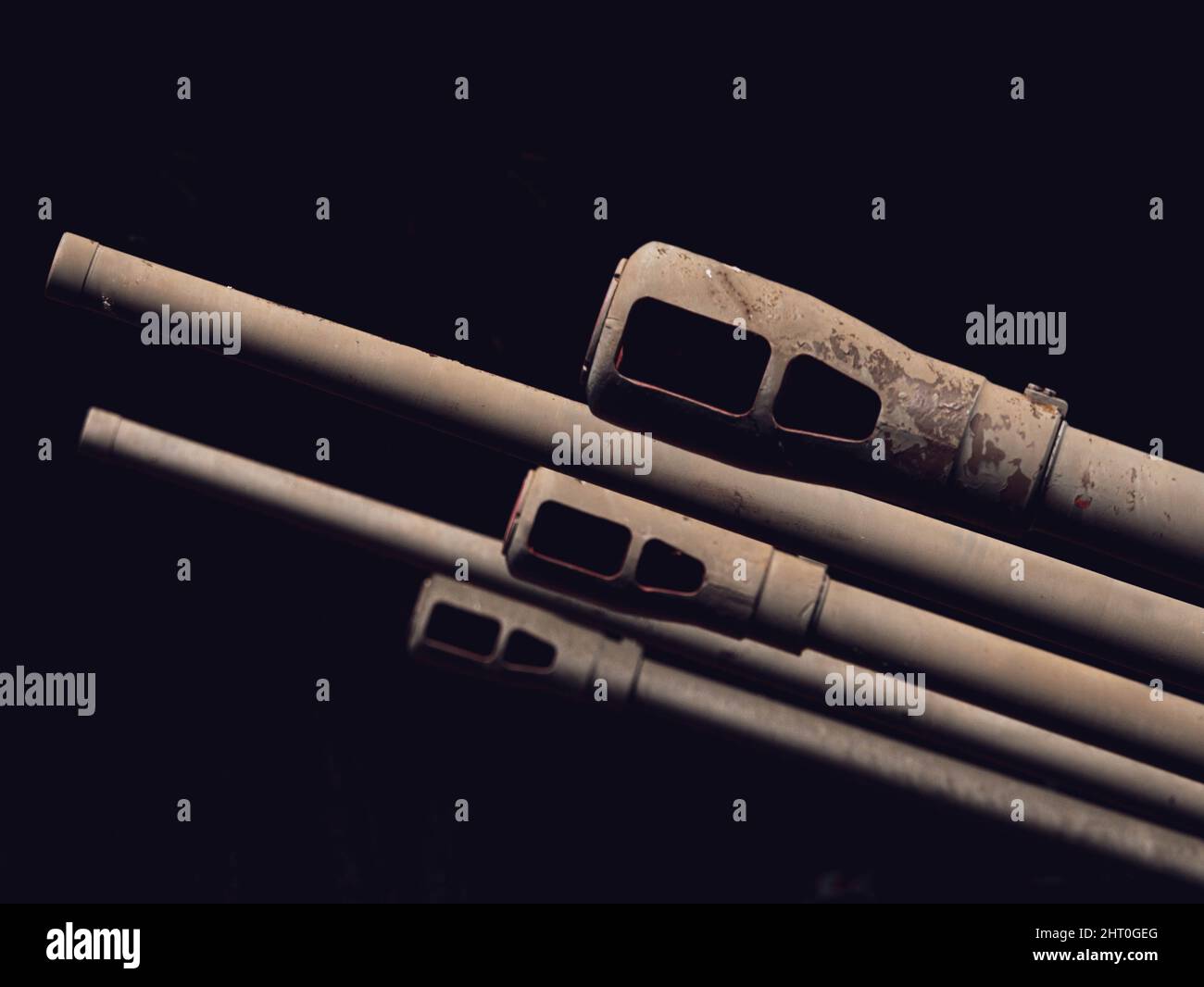 Rusty muzzles of cannon with dark background Stock Photo - Alamy