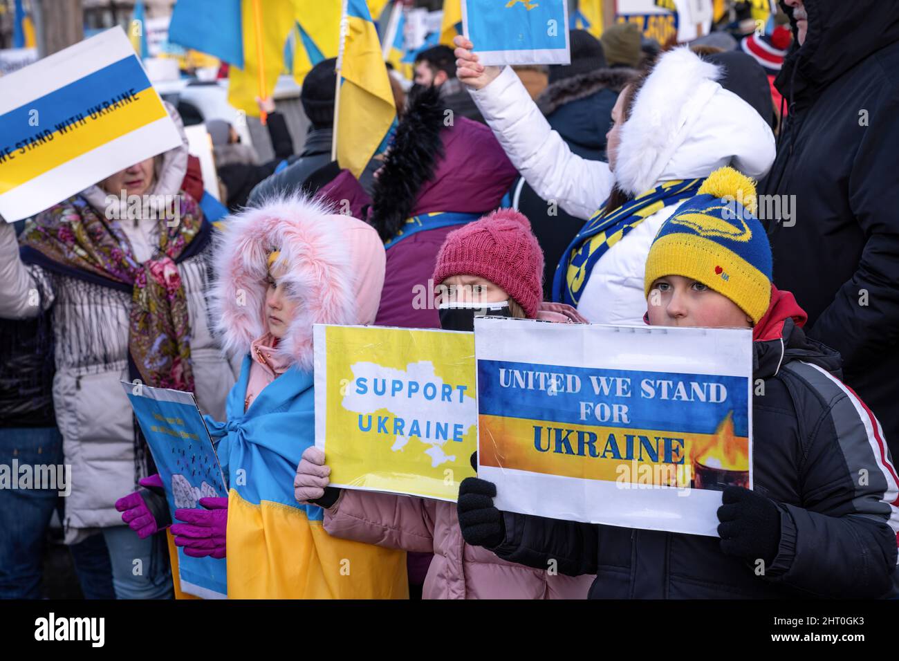 Toronto, Canada. 25th Feb, 2022. Kids hold up signs in support of ...