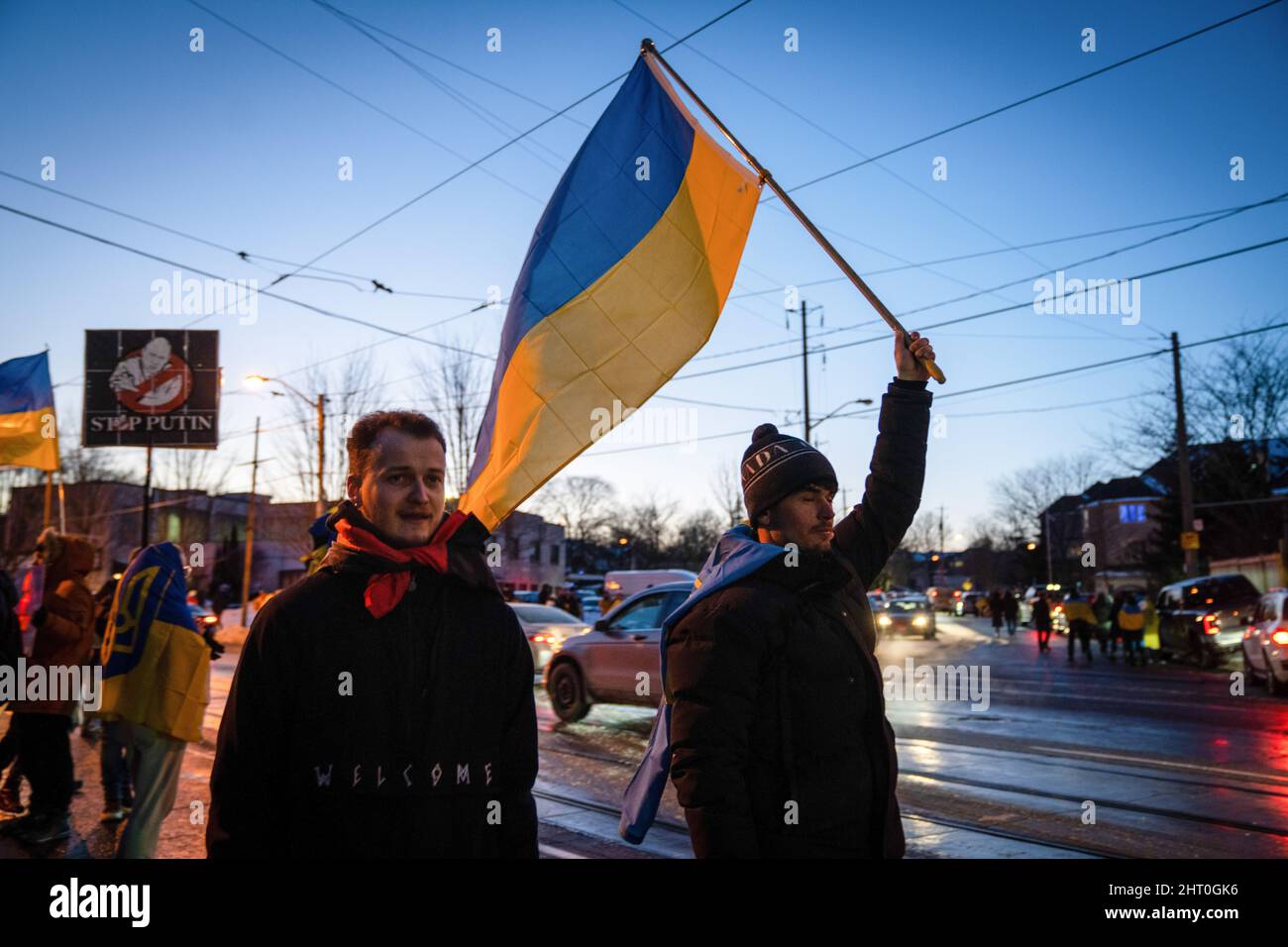 Toronto, Canada. 25th Feb, 2022. A protester is seen holding a ...