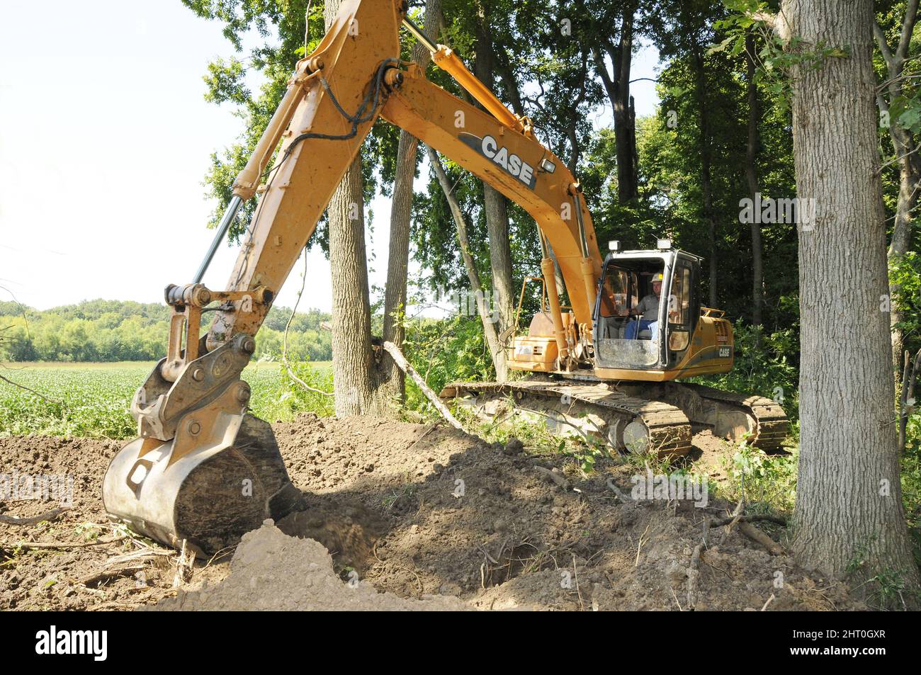 Perspective shot of a construction crane in a field Stock Photo - Alamy