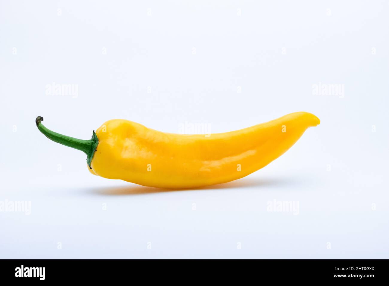 Yellow chili pepper isolated on a white background Stock Photo - Alamy