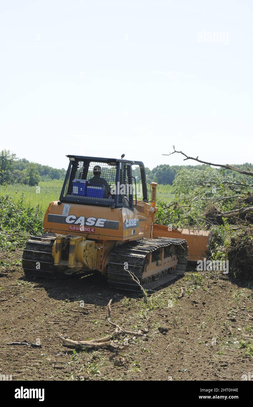 Vertical shot of a crawler bulldozer in a field Stock Photo - Alamy