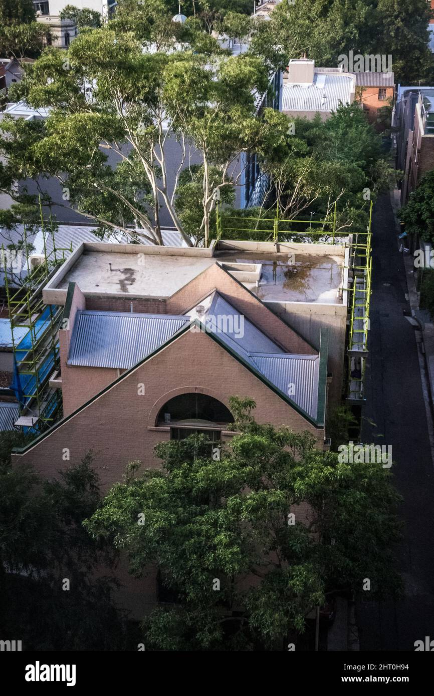 Vertical shot of the building with triangular roof on the street ...