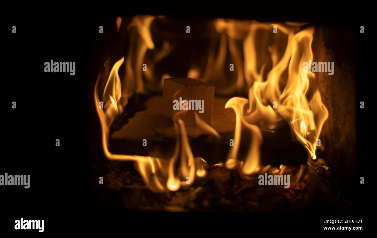 Fire in fireplace. Hearth is in details. Yellow flame. Burning wood ...
