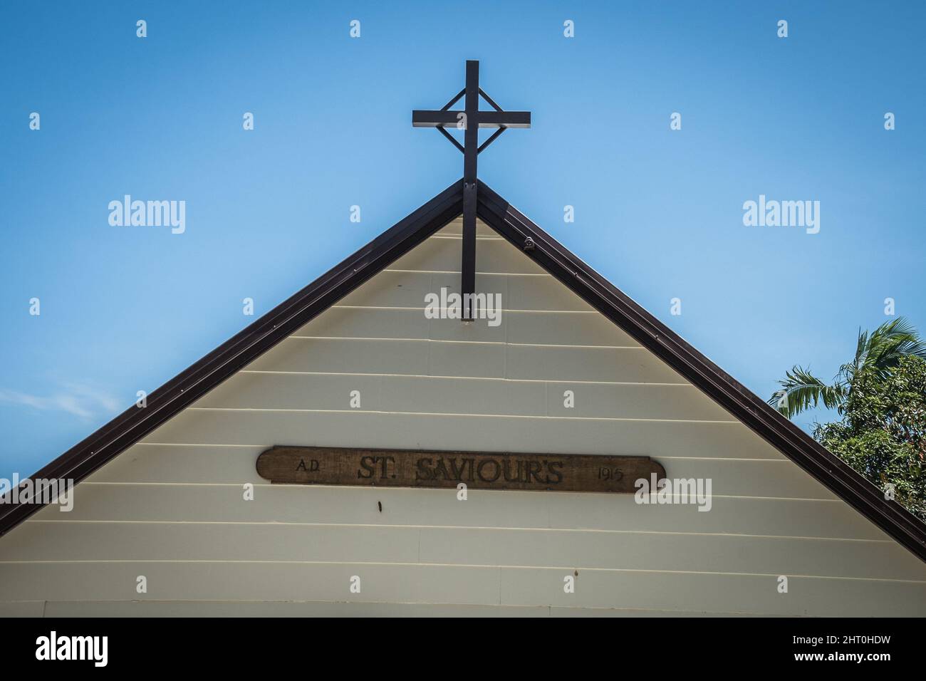 Close-up shot of a cross sign on a triangle roof Stock Photo - Alamy