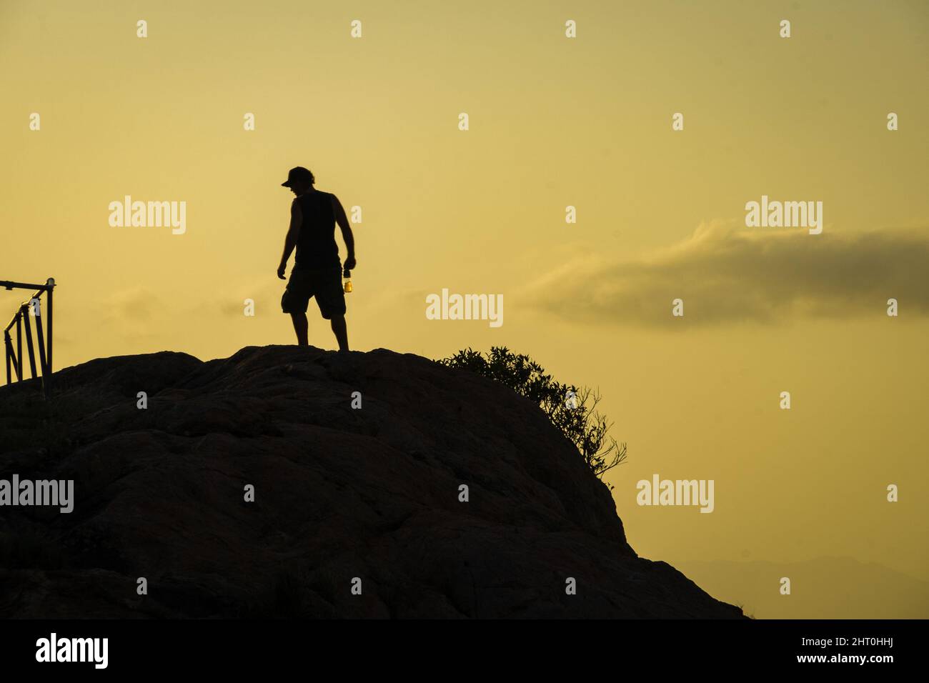 Male person silhouette on a hill isolated on a yellow background Stock ...