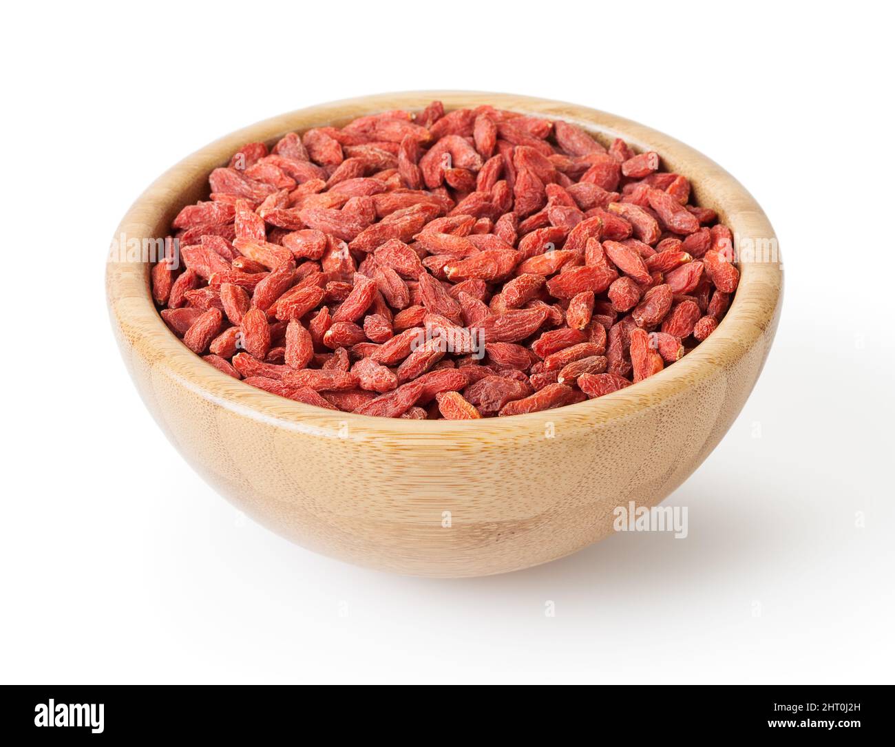 Dried goji berries in wooden bowl isolated on white background with ...