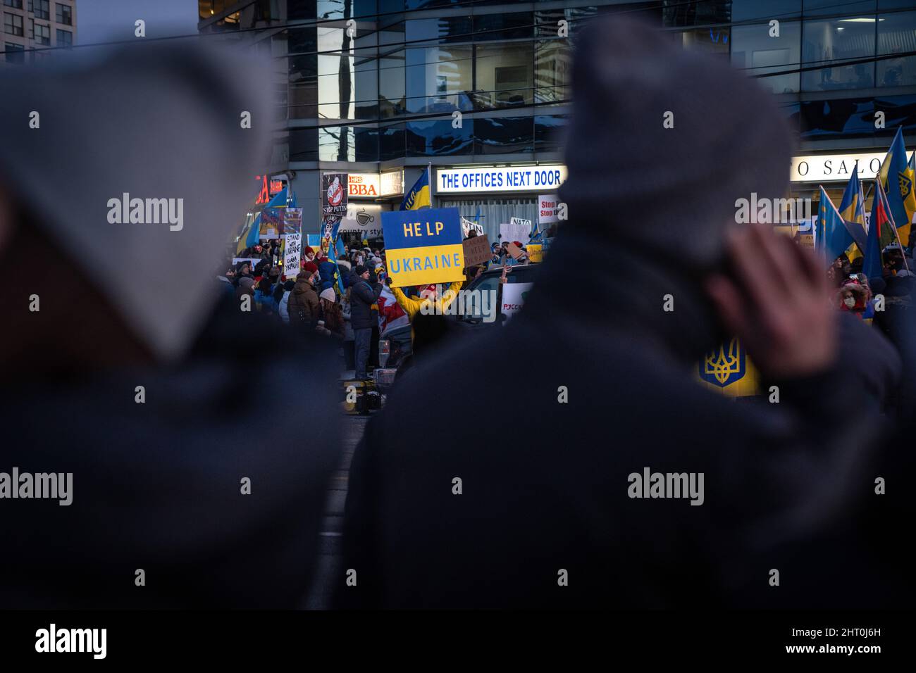 Toronto, Canada. 25th Feb, 2022. A protestor holding a ìHelp Ukraineî ...