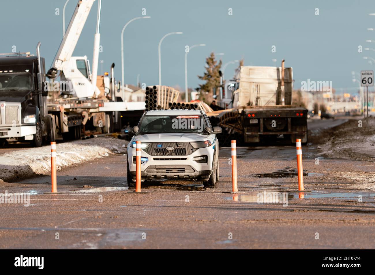 Airdrie police car blocking the traffic at a semi-truck rollover Stock ...