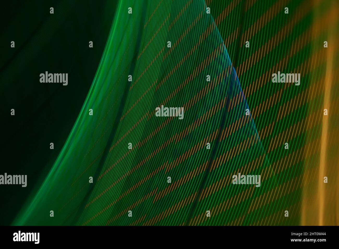 Abstract of green and orange light against dark background Stock Photo ...