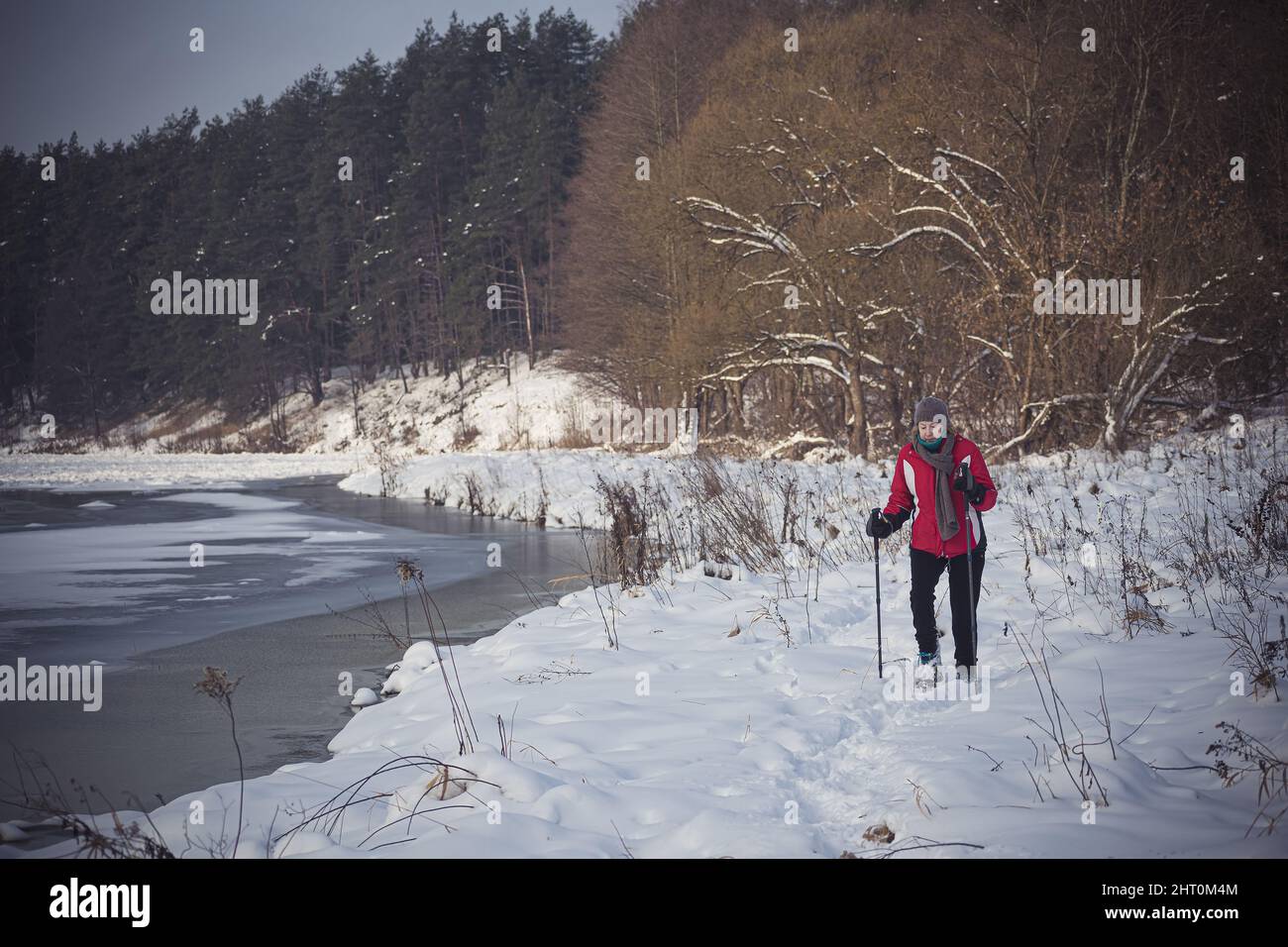 Active woman hiking with poles in Neris Regional Park, Lithuania during ...