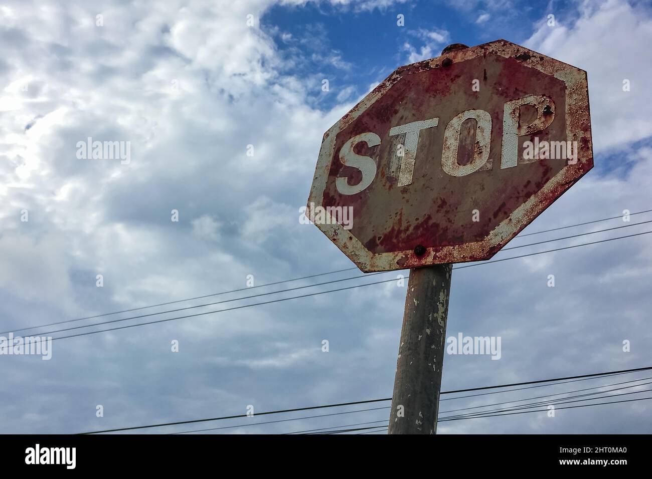 Closeup of a rusty vintage worn out stop sign viewed from below Stock ...