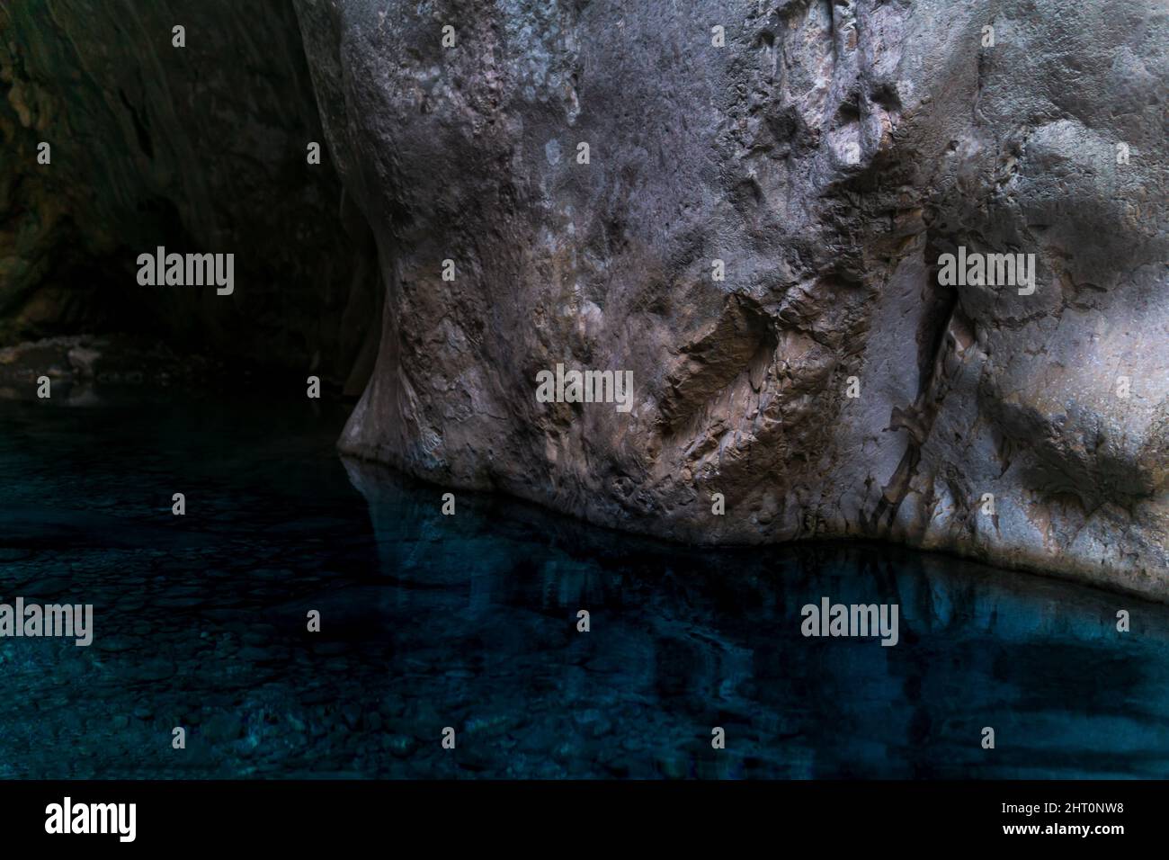 clean underground cave river in steep stone banks in the dark Stock ...