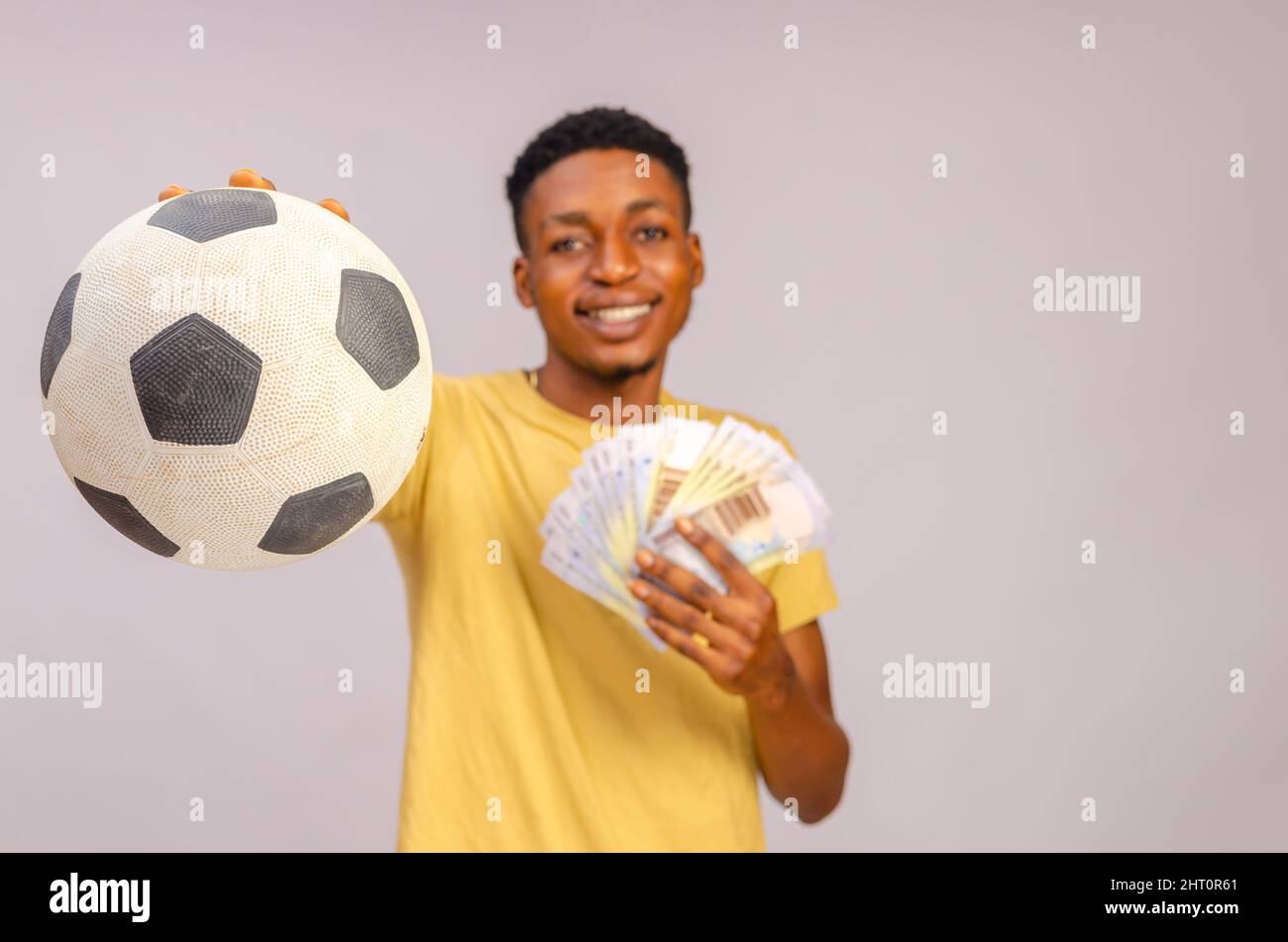 african guy isolated over white background pointing his ball forward ...